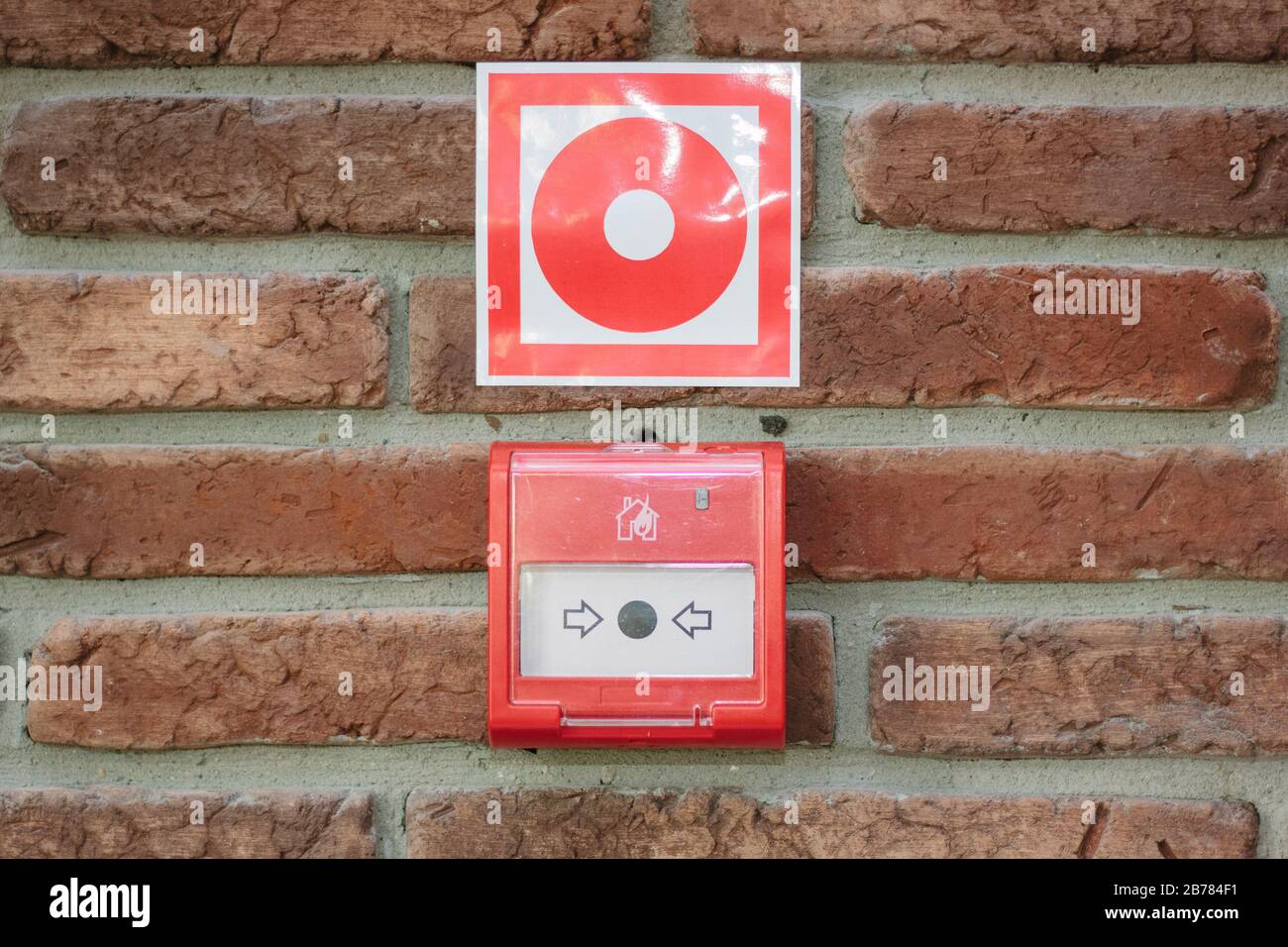 Fire alarm button in emergency system over a wall Stock Photo - Alamy