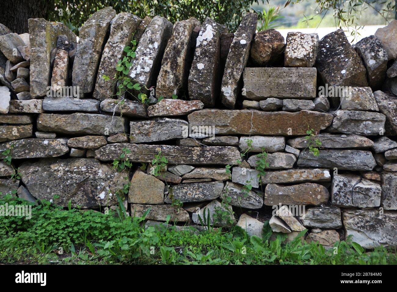 traditional slate stone wall on portuguese countryside on the algarve ...
