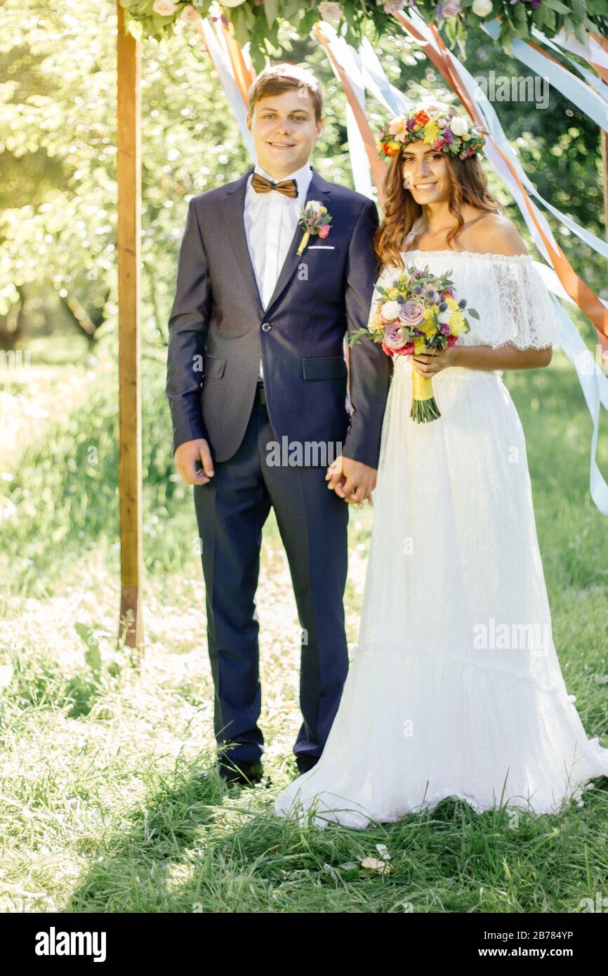 Beautiful wedding couple - bride and groom during wedding ceremony ...