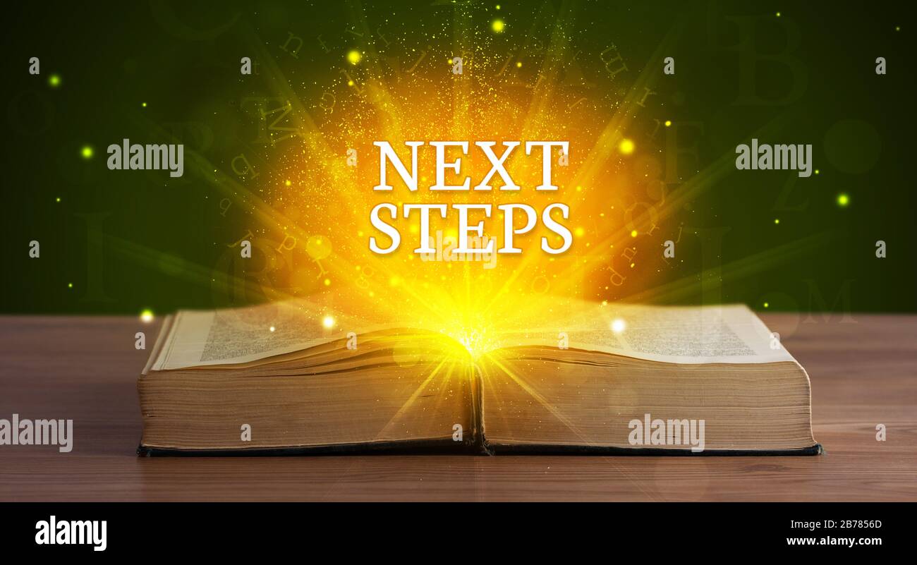 NEXT STEPS inscription coming out from an open book, educational ...