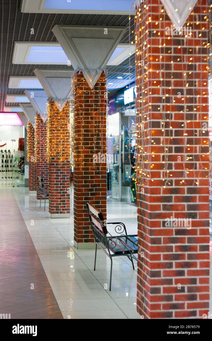 Christmas decoration of brick column in mall Stock Photo - Alamy