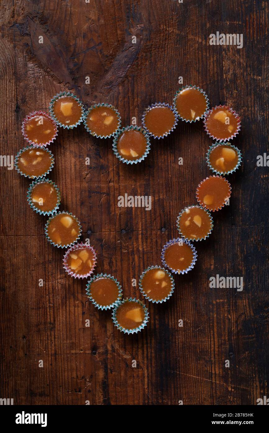 Swedish christmas butterscotch candy knäck in the shape of a heart, on ...