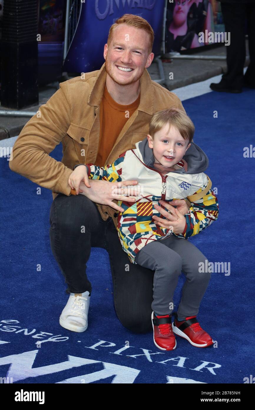 Greg Rutherford and son attending the Onward UK Premiere at the Curzon ...