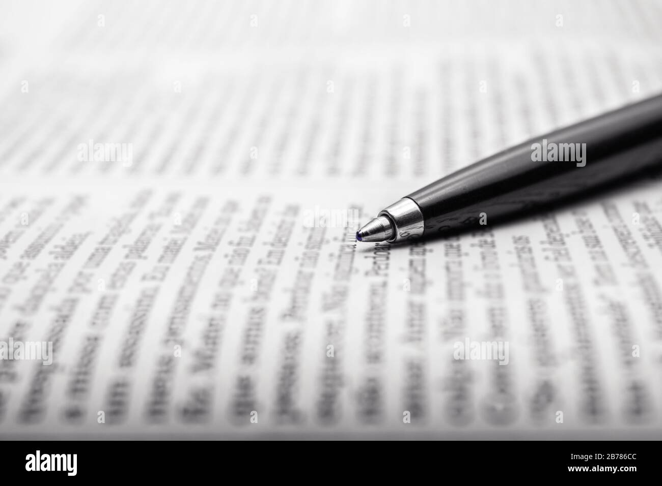 close up of pen opened over a newspaper Stock Photo - Alamy