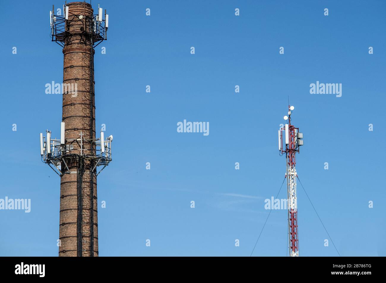 Old brick chimney turn into cellular tower Stock Photo - Alamy