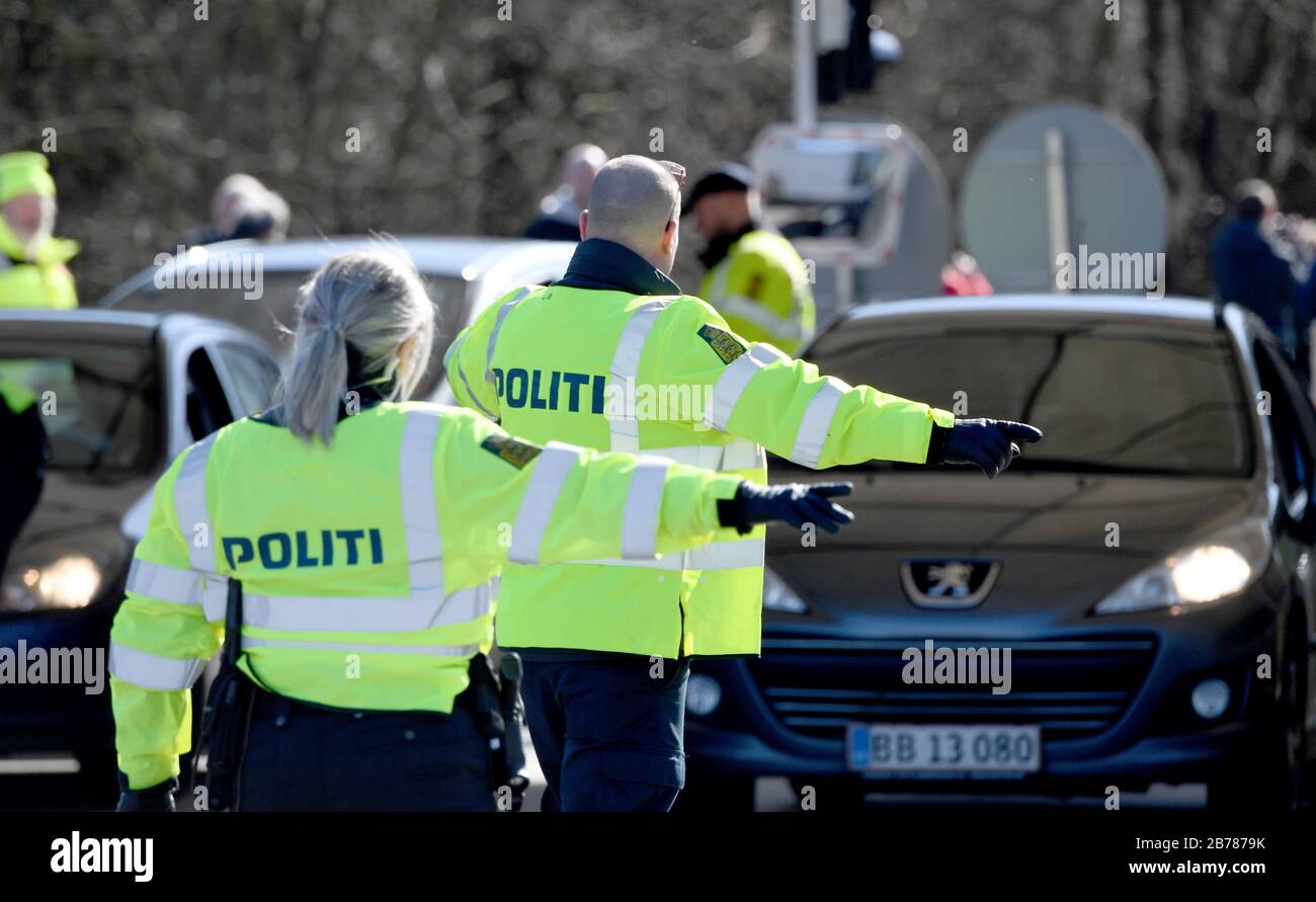 Flensburg, Germany. 14th Mar, 2020. Police officers check vehicles ...