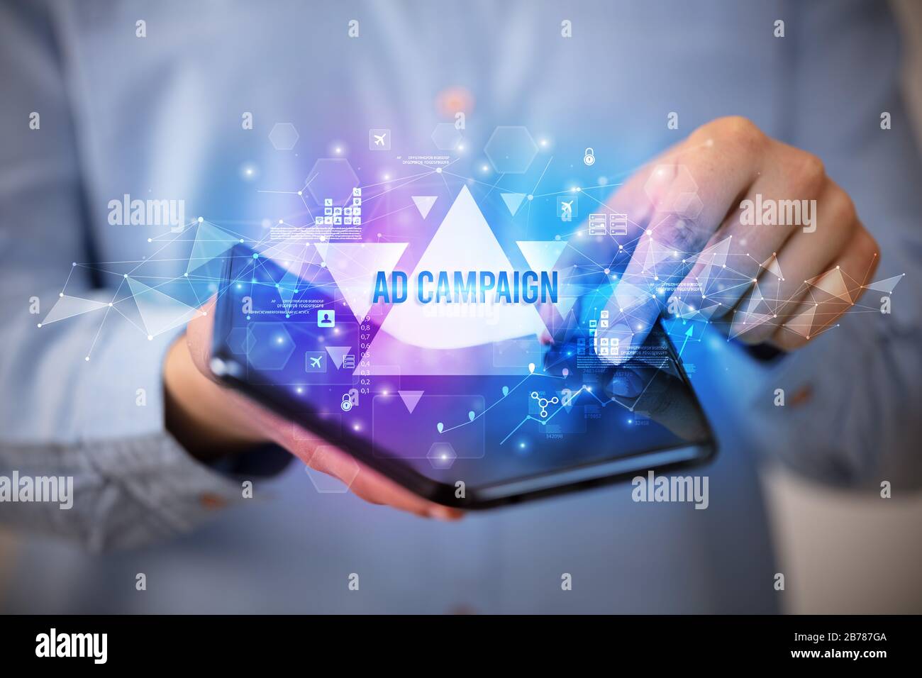 Businessman holding a foldable smartphone with AD CAMPAIGN inscription ...