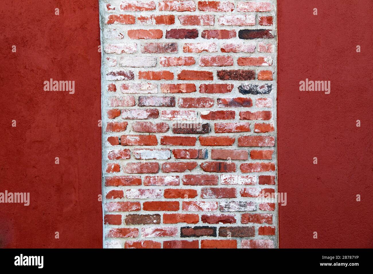 a bright red painted vintage brick garden wall column Stock Photo - Alamy