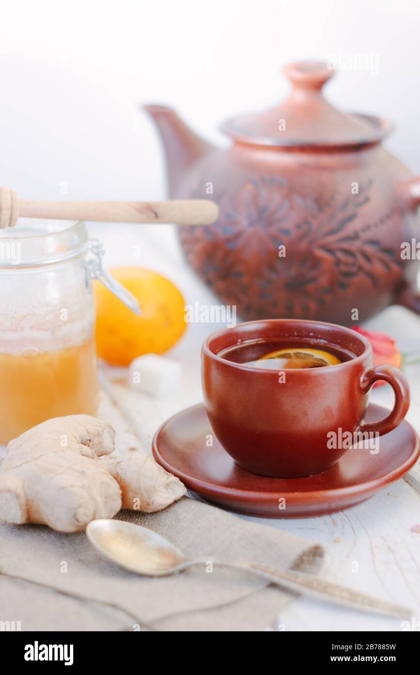 Ginger tea with lemon, lime and honey on white Stock Photo - Alamy