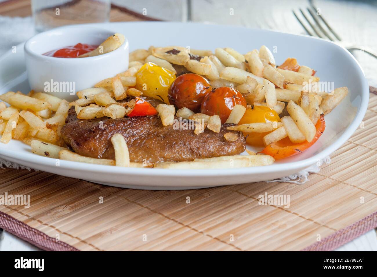 Vegetarian steak made from vegan meat - seitan, with cherry tomatoes ...