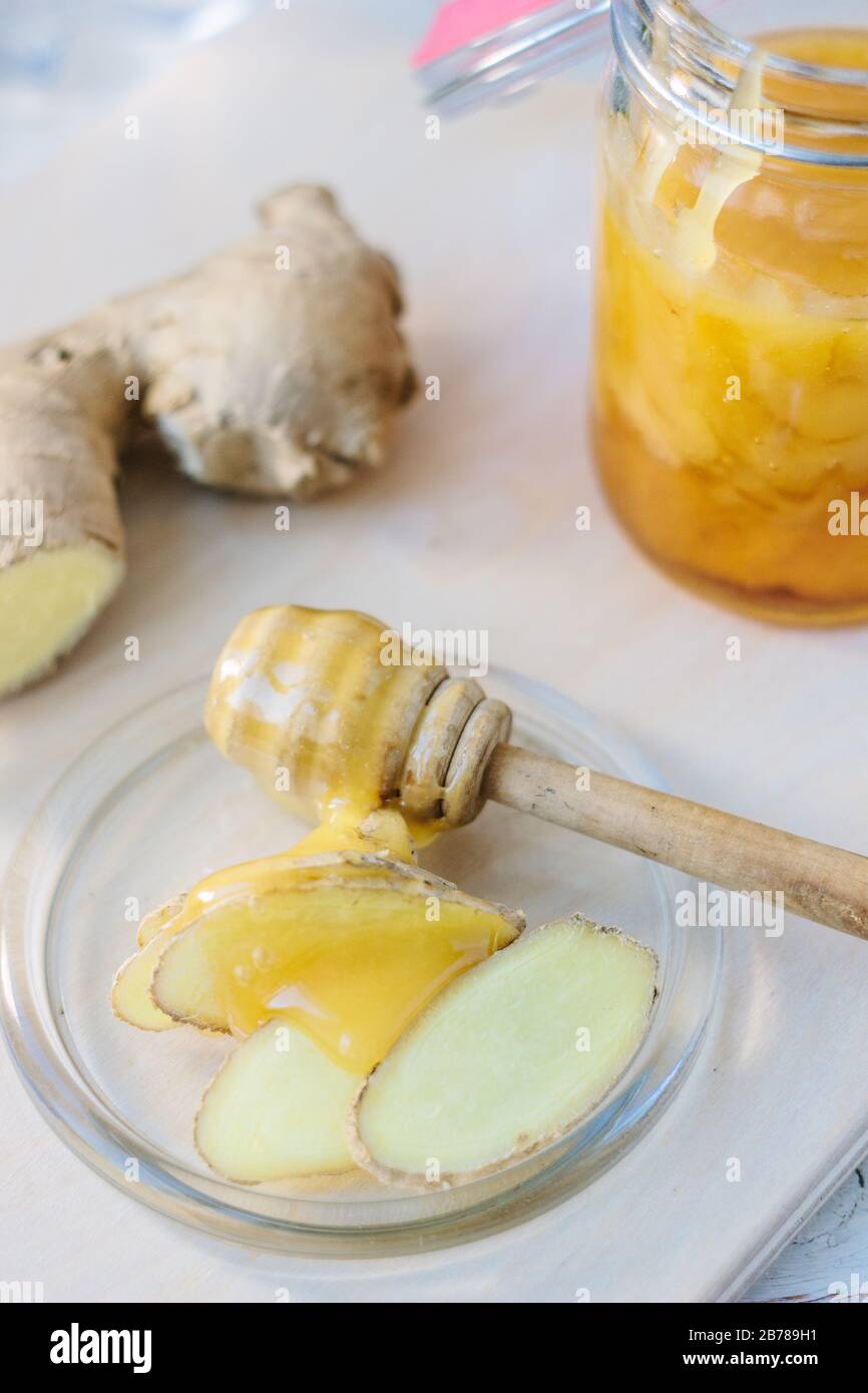 Healthy eating - honey and ginger root slices Stock Photo - Alamy
