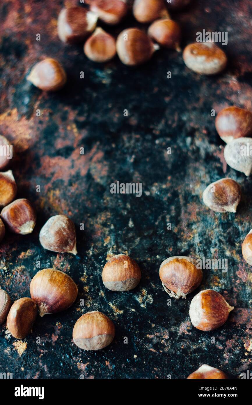 Chestnuts frame on black metal rustic surface Stock Photo - Alamy