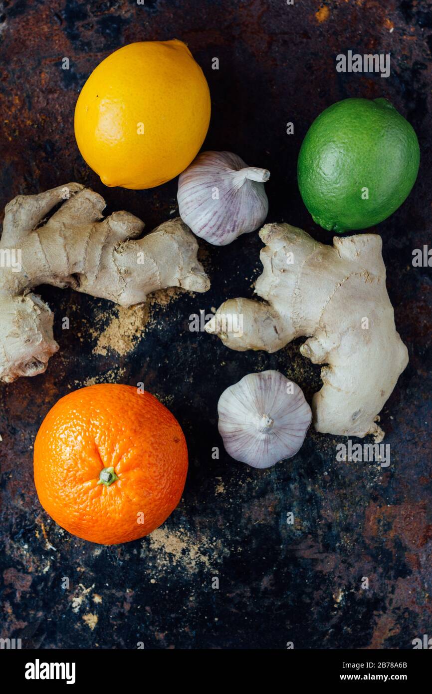Citrus fruits with garlic and ginger root Stock Photo - Alamy