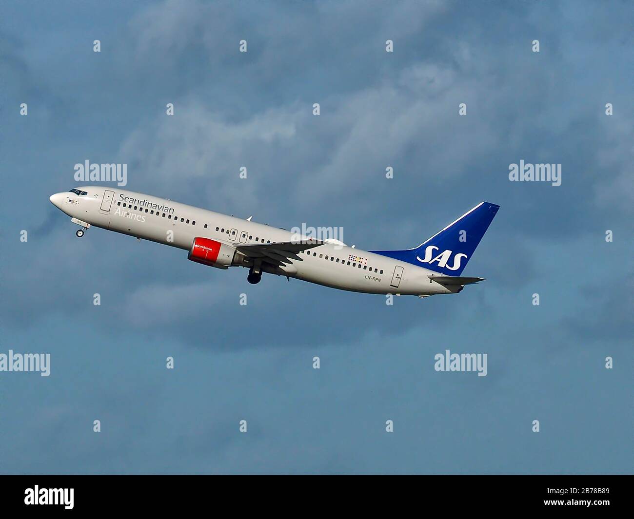 Flying Sas airplane in front of blue sky Stock Photo - Alamy