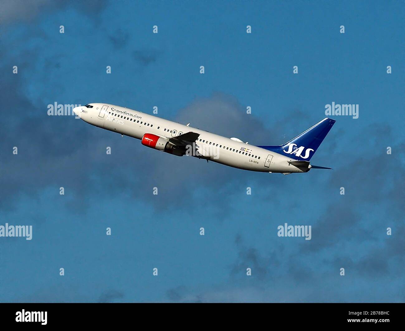 Flying Sas airplane in front of blue sky Stock Photo - Alamy
