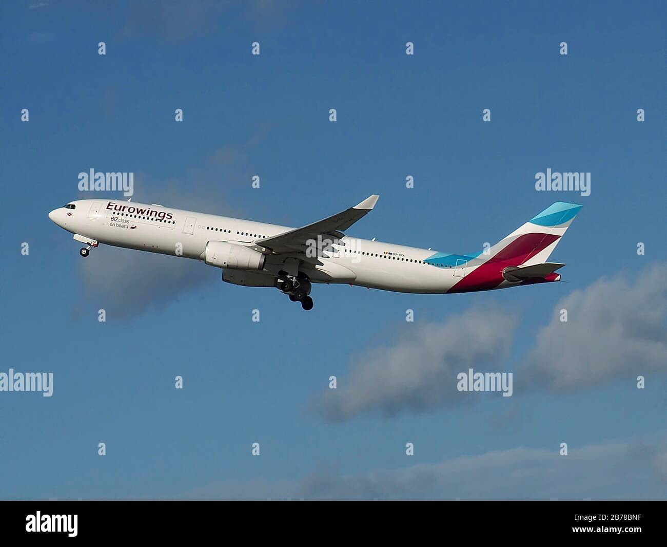Flying Eurowings airplane in front of blue sky Stock Photo - Alamy
