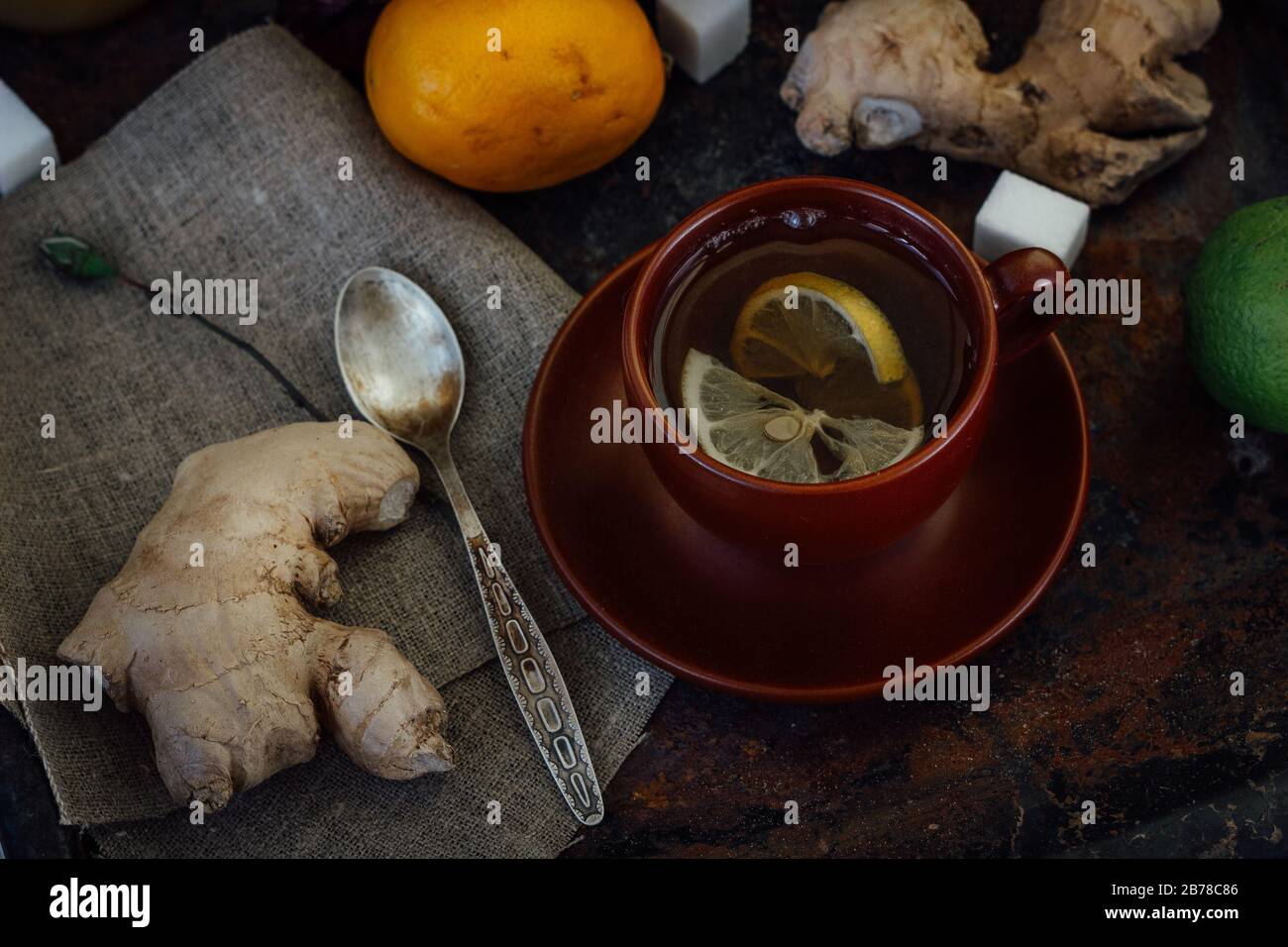 Ginger tea with lemon, lime and sugar Stock Photo - Alamy