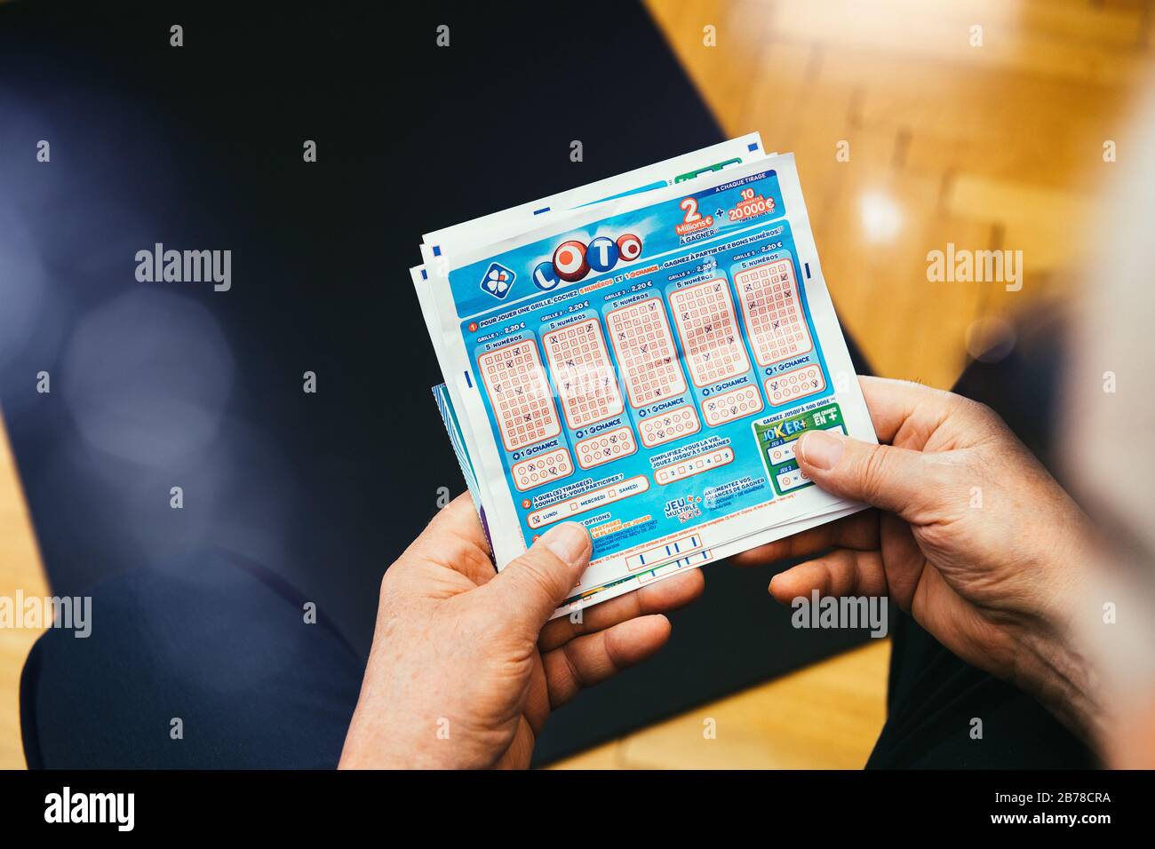 Paris, France - Apr 2, 2019: POV of senior male hands holding multiple ...