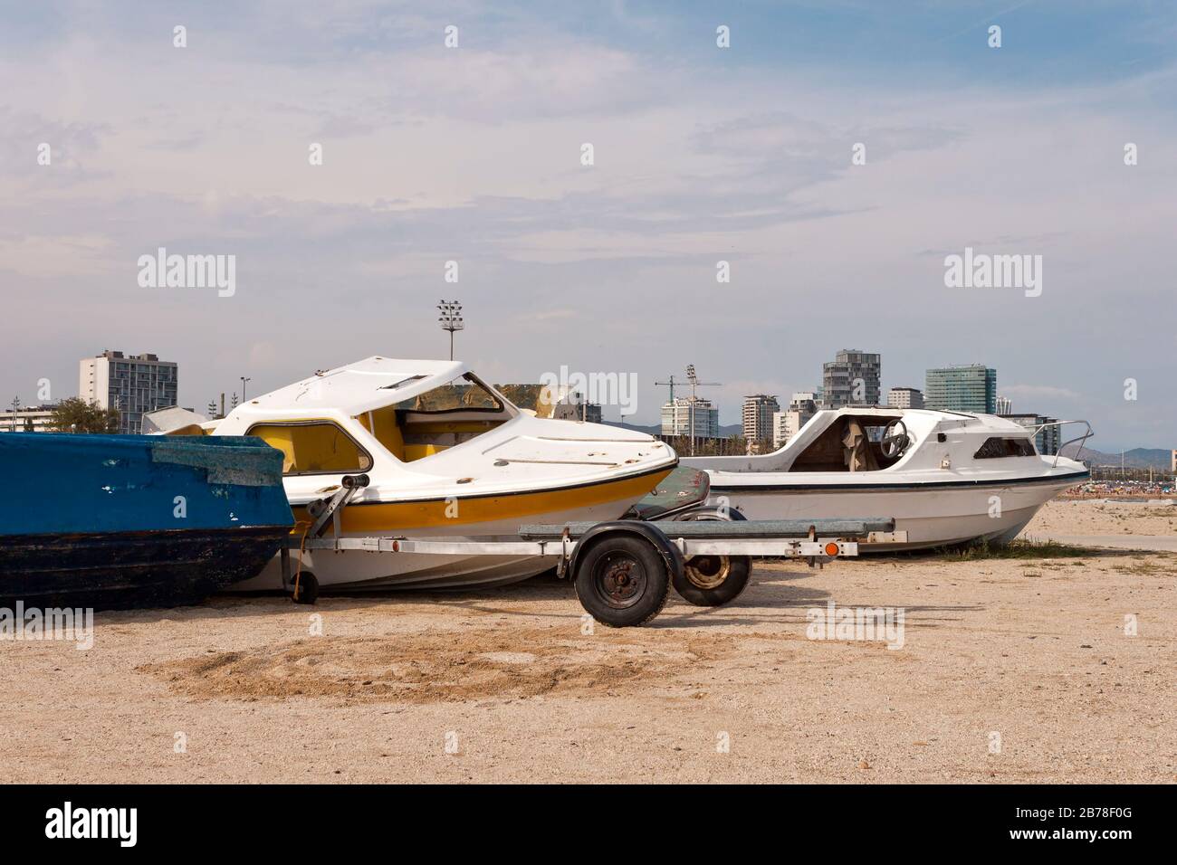 Abandoned rusty boats and trailer on the beach Stock Photo - Alamy