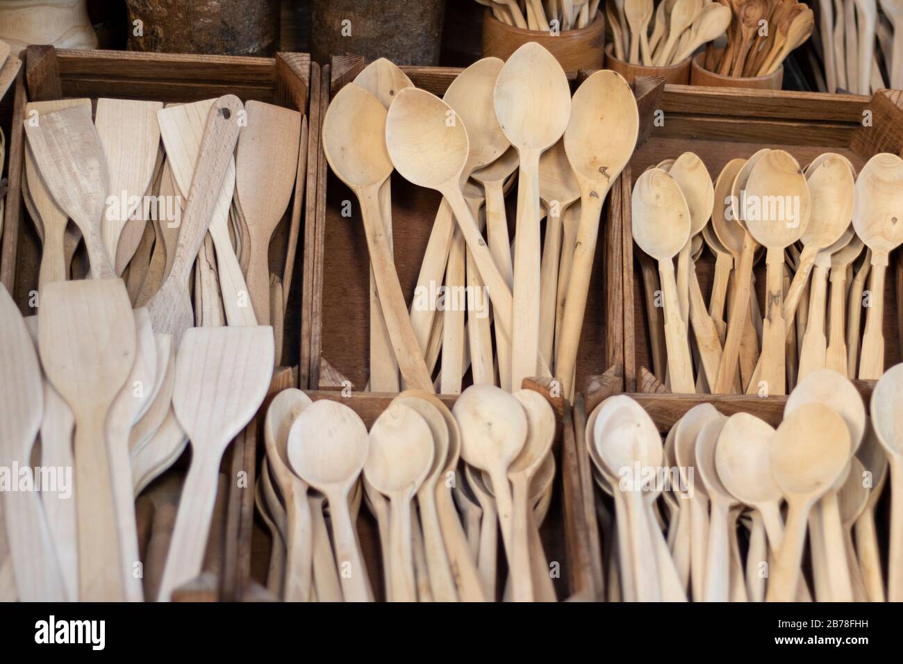 Wooden spoons and fork. Close-up. Light brown color Stock Photo - Alamy