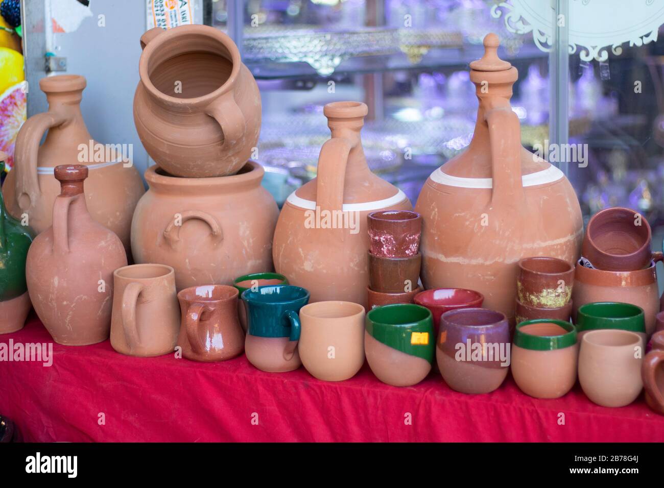 Containers made of clay. Photographed in front of the bench. There are ...