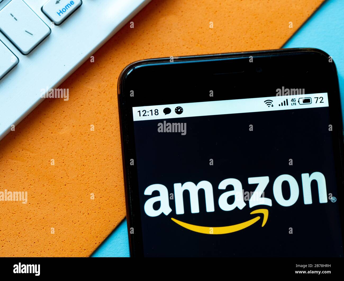 In this photo illustration an Amazon logo seen displayed on a ...