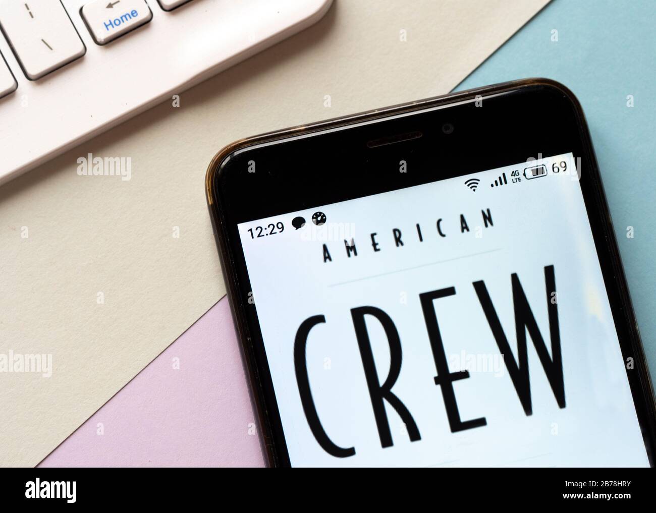 In this photo illustration an American Crew logo seen displayed on a ...