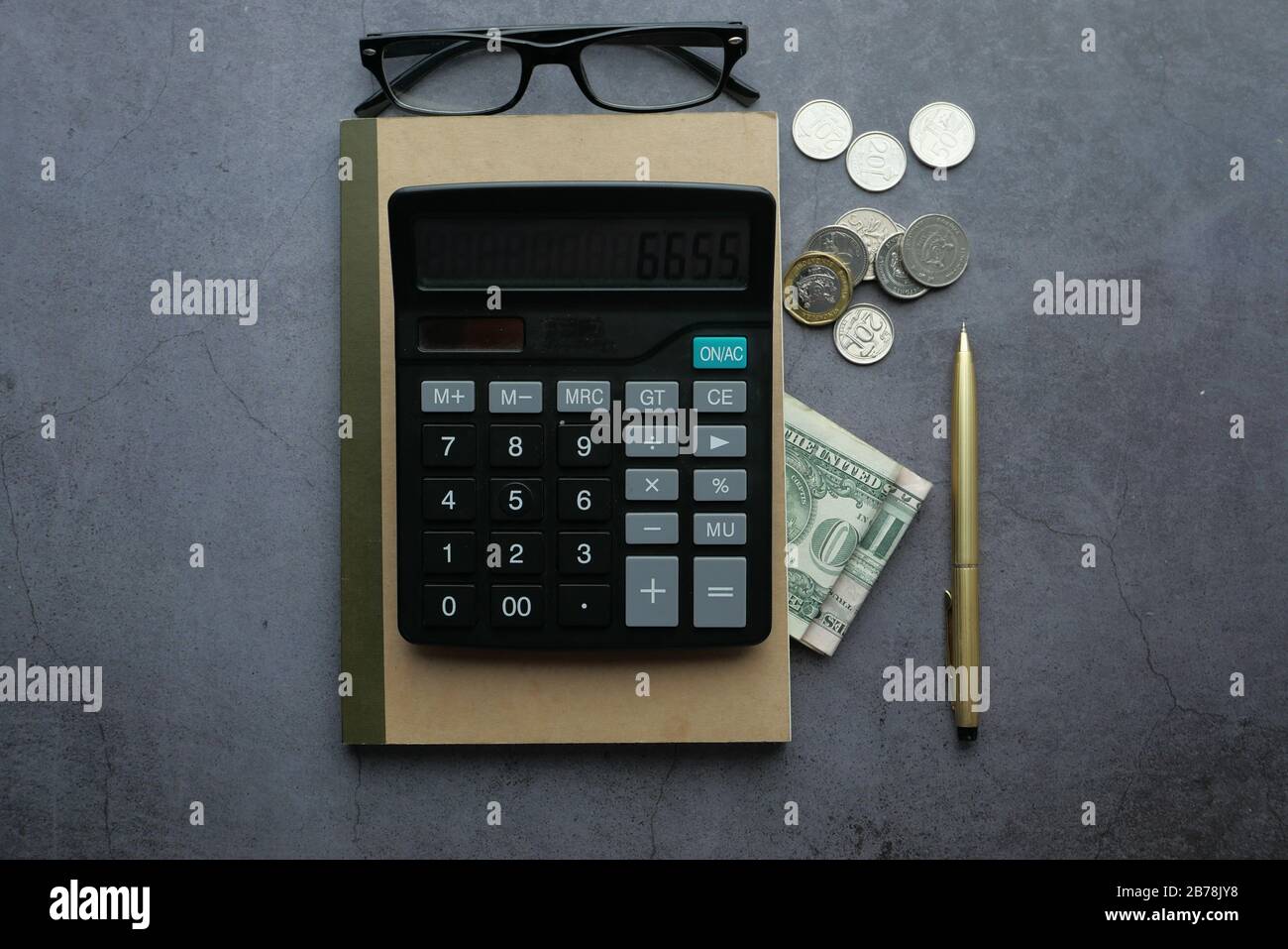 top view of cash , calculator and notepad on table Stock Photo - Alamy