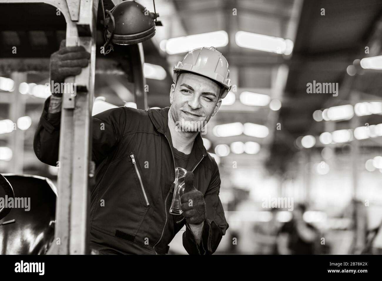 Portrait of Caucasian factory worker handsome smart with safety clothes ...