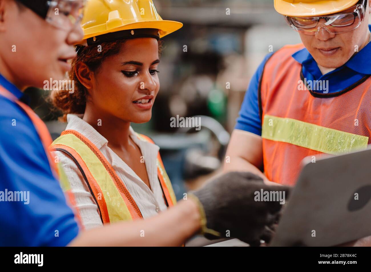 engineer team mix race working together in heavy industry with laptop ...