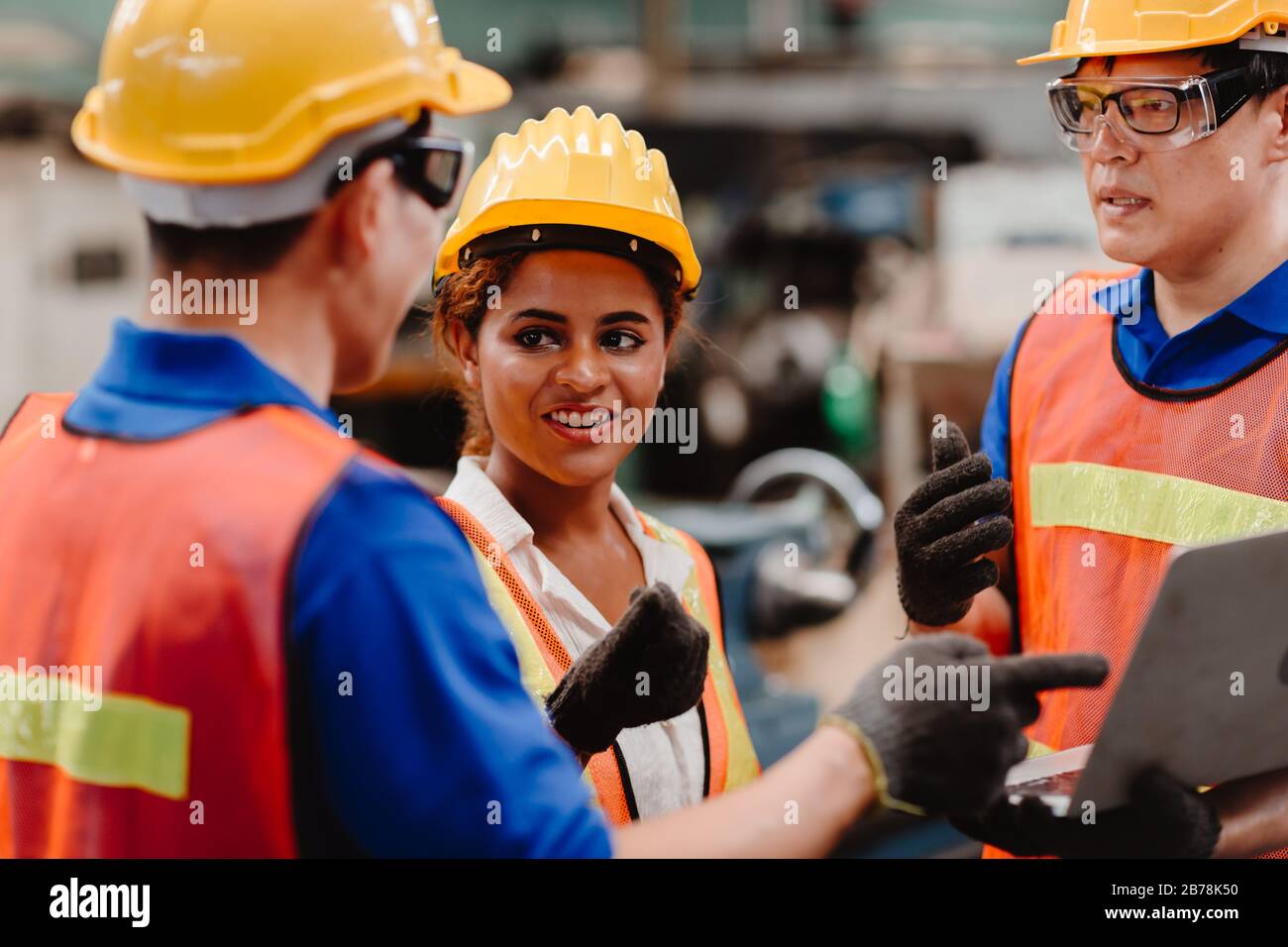 engineer team mix race working together in heavy industry with laptop ...