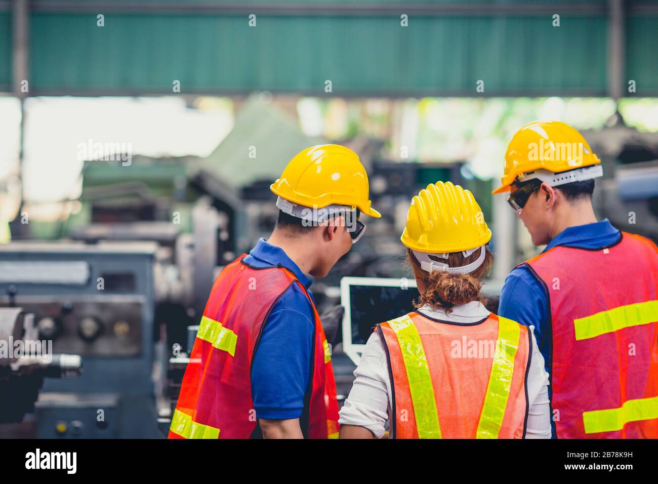 engineer team mix race working together in heavy industry with laptop ...