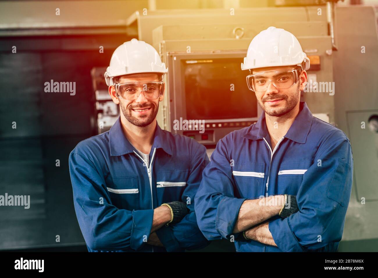 two worker engineer man standing arm folding smiling with machine in ...