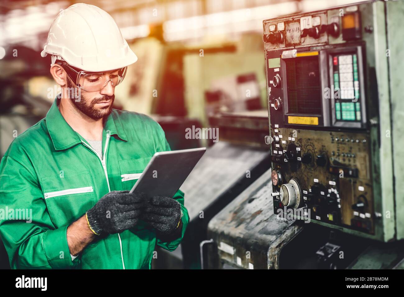 Green eco worker checking energy consumption engieer working in heavy ...