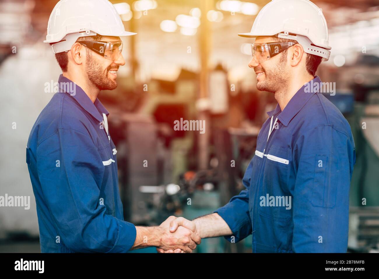 Worker engineer team smiling handshake for finish working dealing job ...