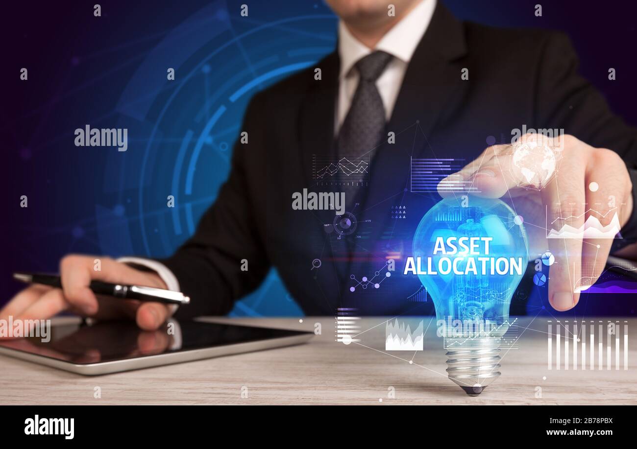 Businessman holding lightbulb with ASSET ALLOCATION inscription ...