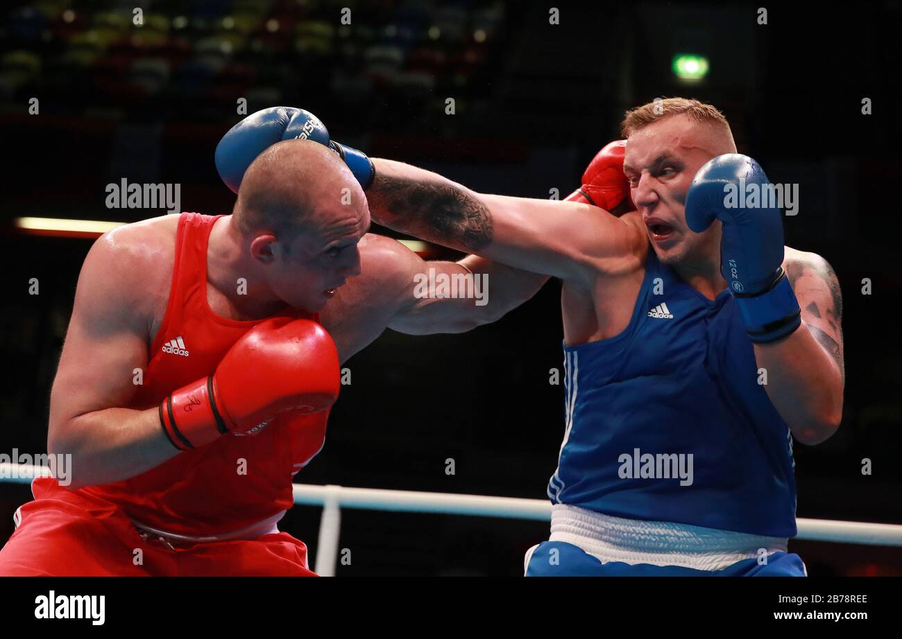 Romania's Daniel Burciu (red) and Denmark's Morten Givskov (blue ...