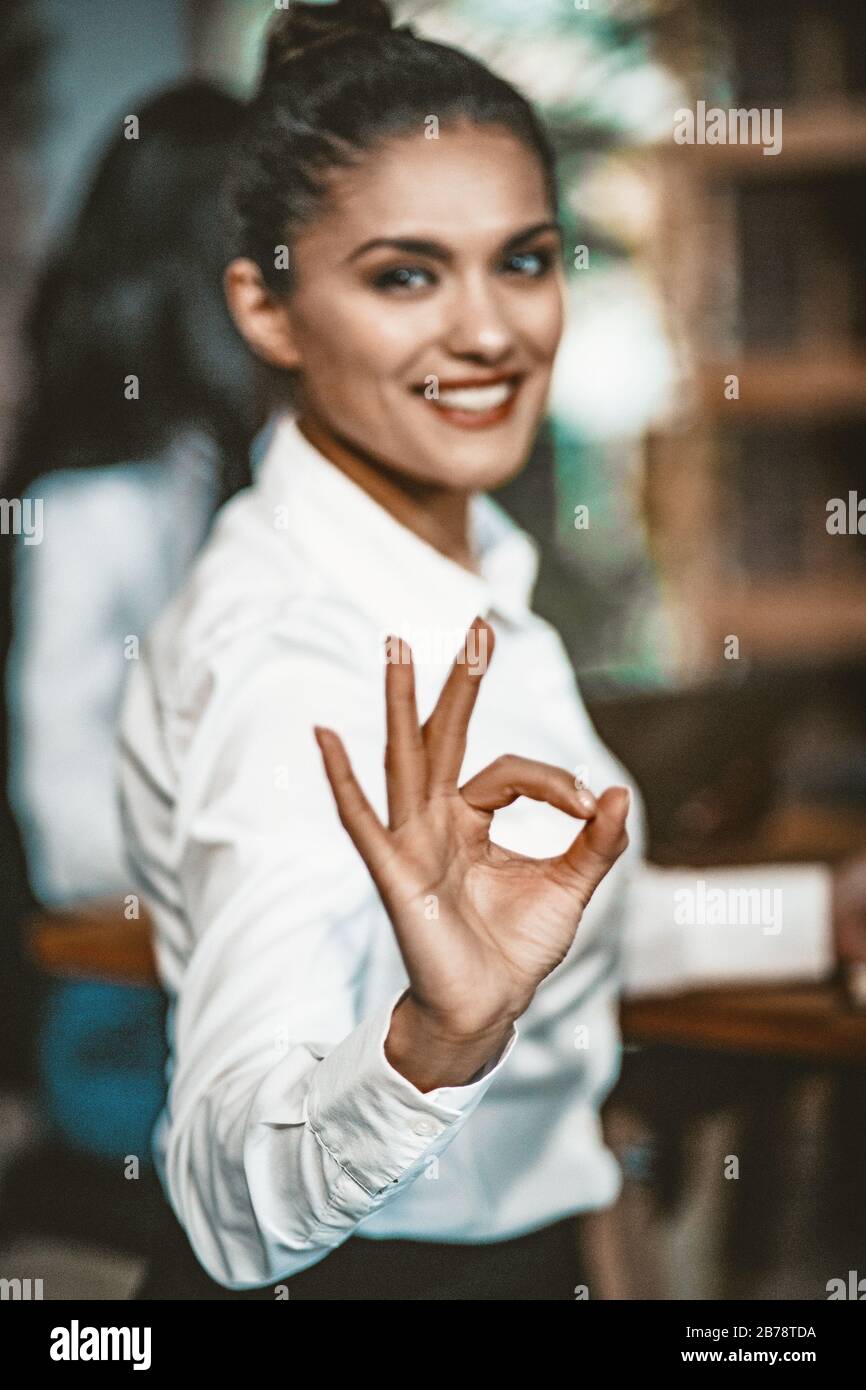 Cute Business Woman Showing Ok And Smiling Stock Photo - Alamy