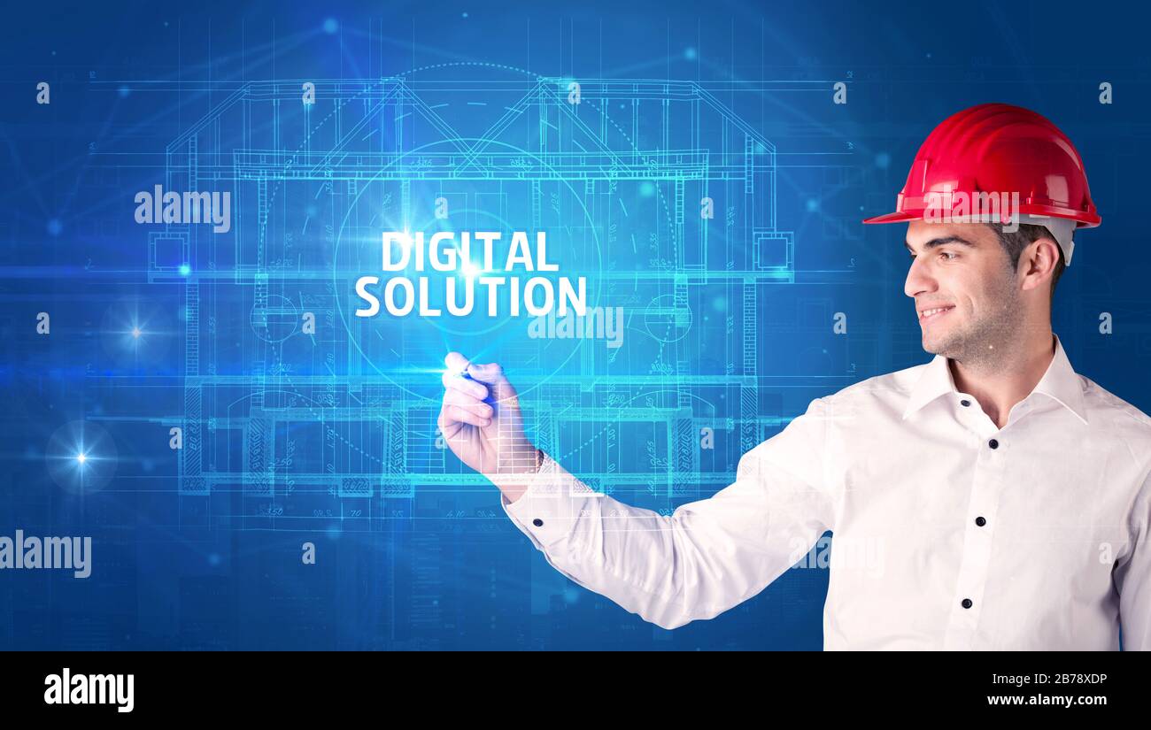 Handsome architect with helmet drawing DIGITAL SOLUTION inscription ...