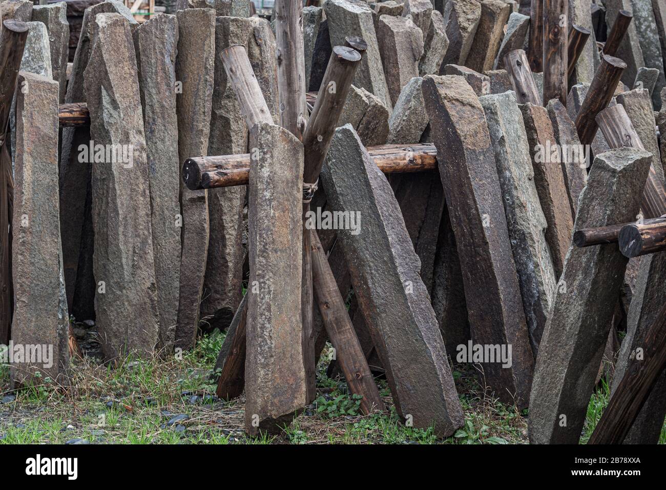 Long thin stones at a builders yard, Kanazawa, Japan Stock Photo - Alamy
