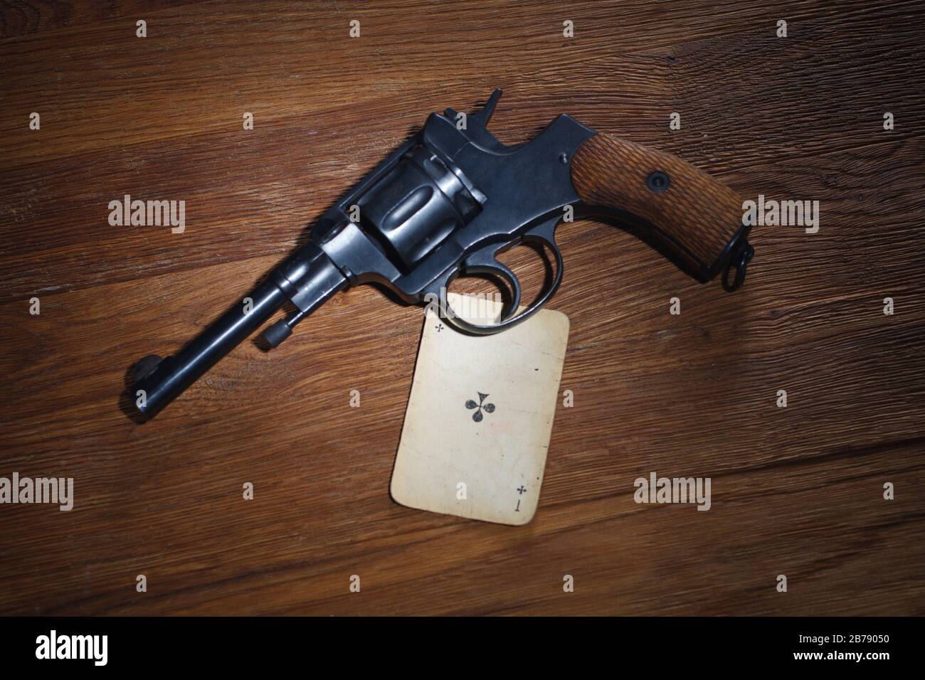 russian roulette - Ace of Clubs plaing card and revolver with one ...