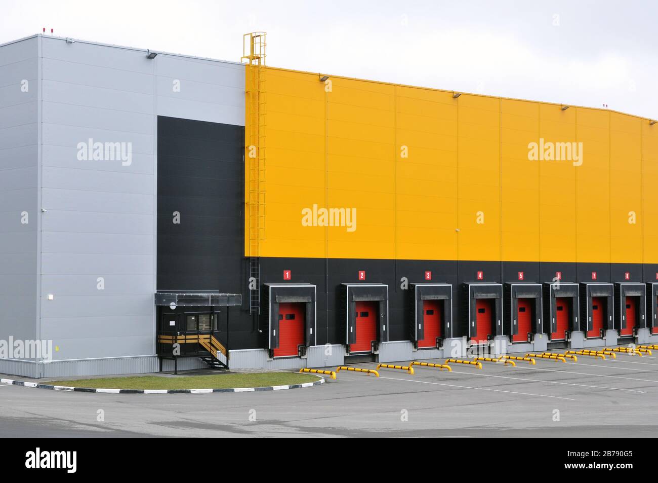 The building of a modern logistics center. Front view of loading docks ...