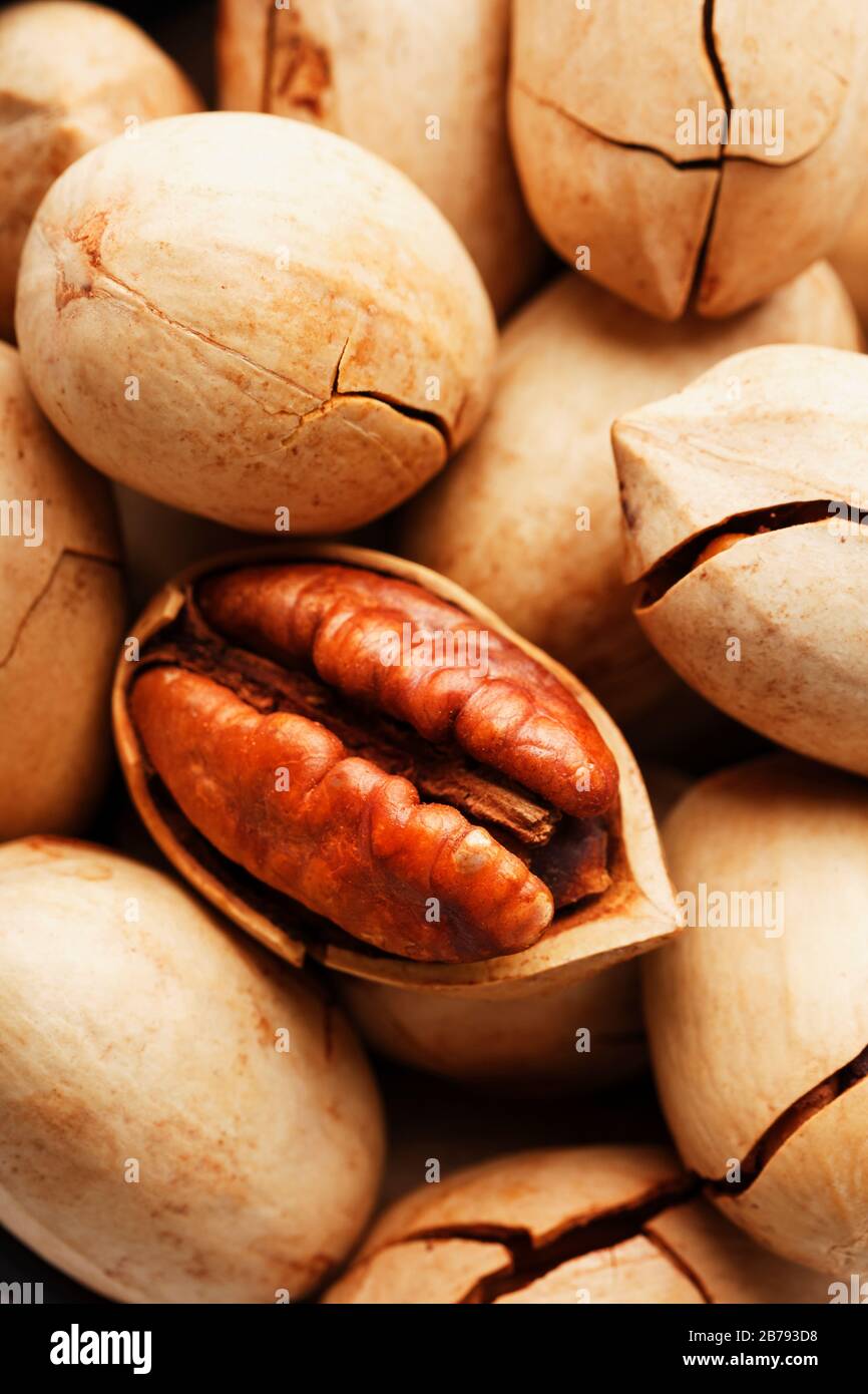 Pecan nuts close-up, macro as the background on the whole screen ...