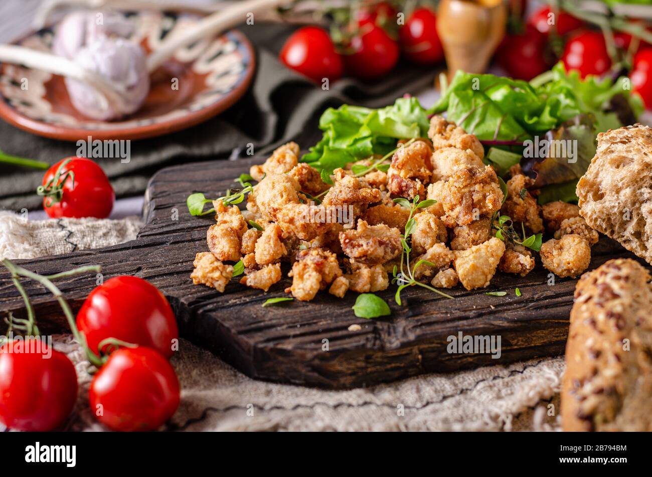 Delicious fat food, fried greaves pork with garlic Stock Photo - Alamy