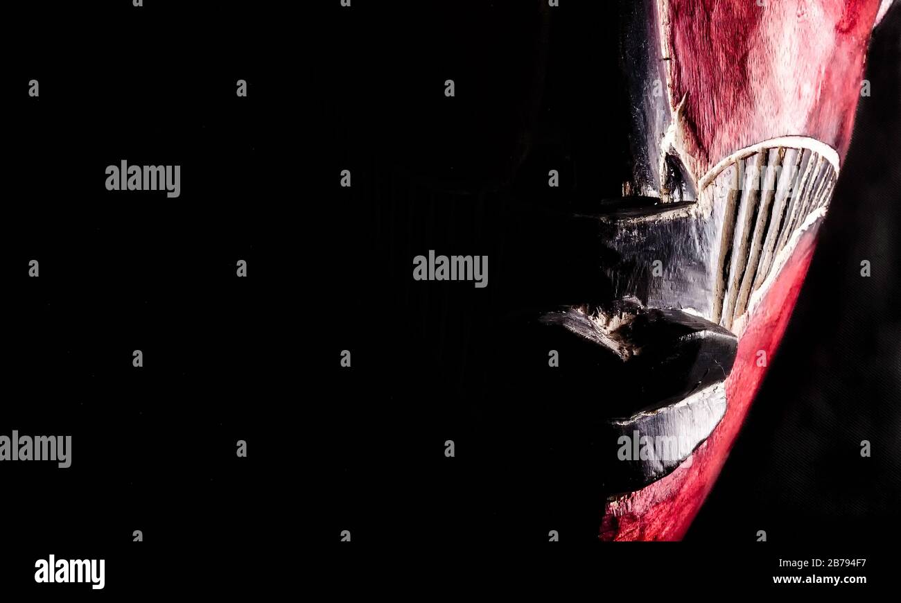 Closeup view of nose, cheek, and mouth of a red male Tikar ritual mask ...