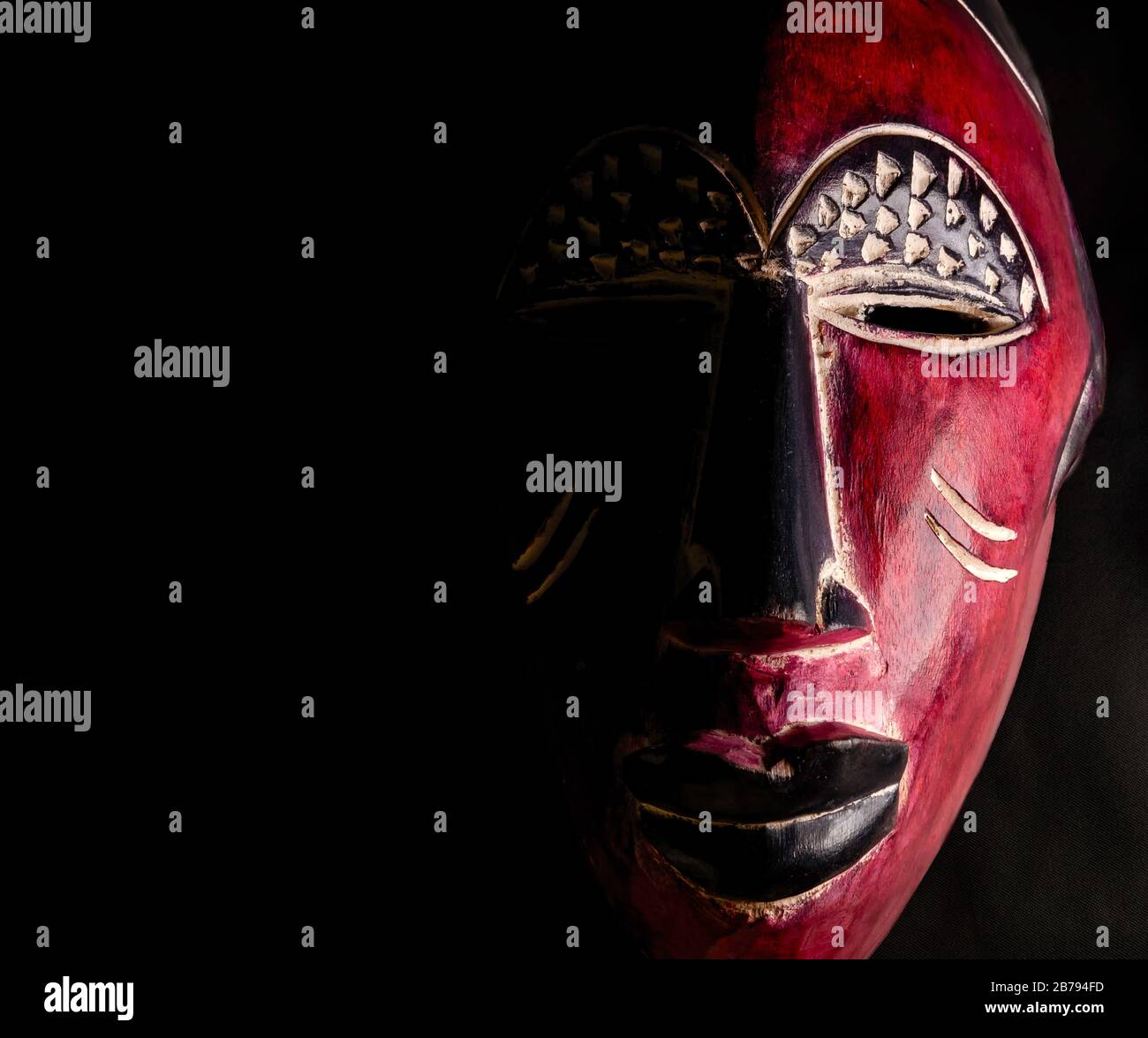 Full view of a red female Tikar ritual mask from Northwest Cameroon ...