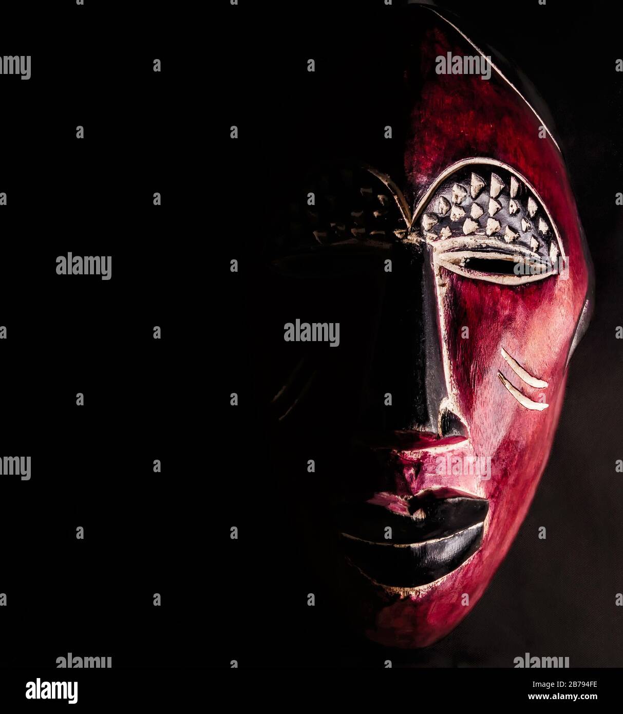 Full view of a red female Tikar ritual mask from Northwest Cameroon ...