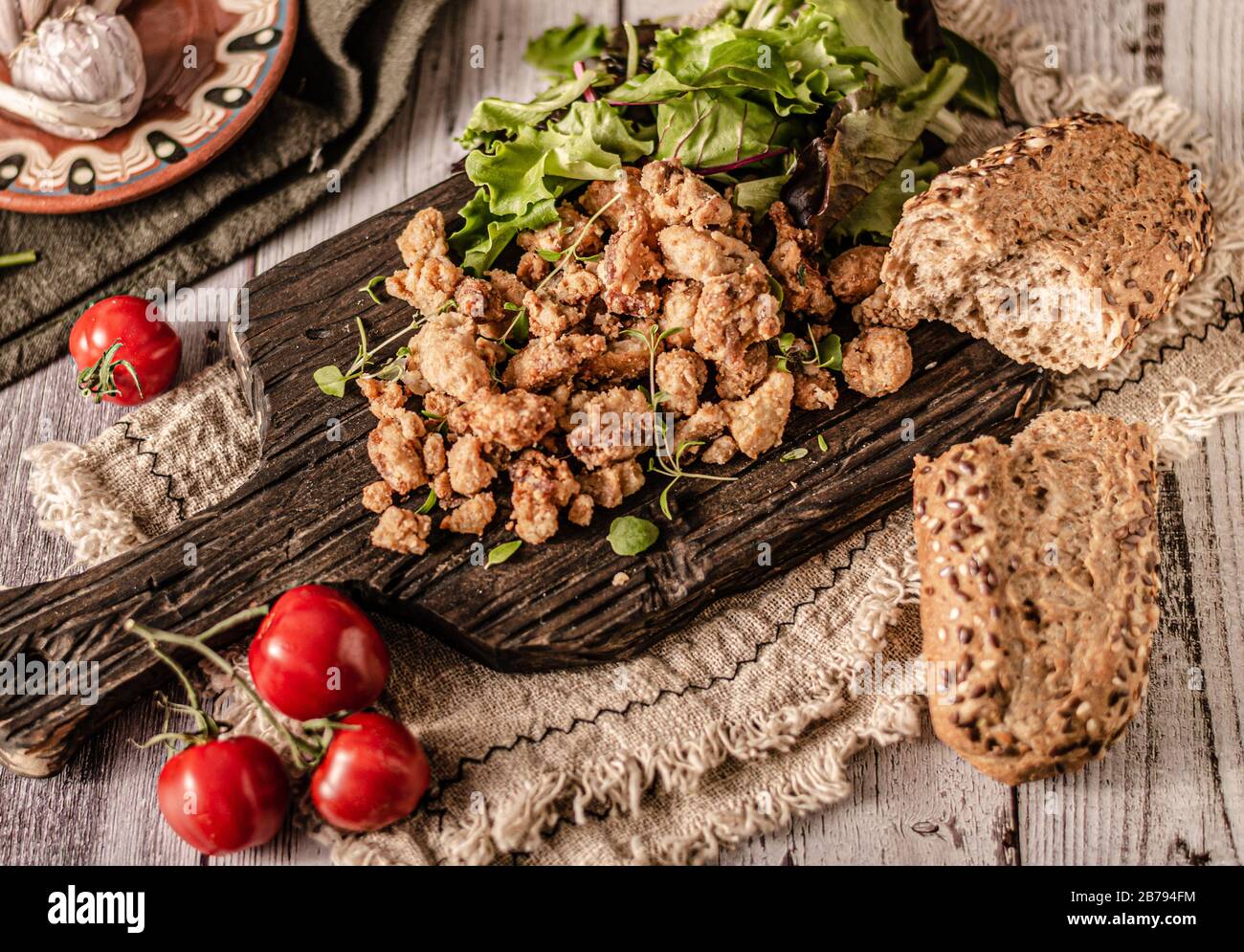 Delicious fat food, fried greaves pork with garlic Stock Photo - Alamy