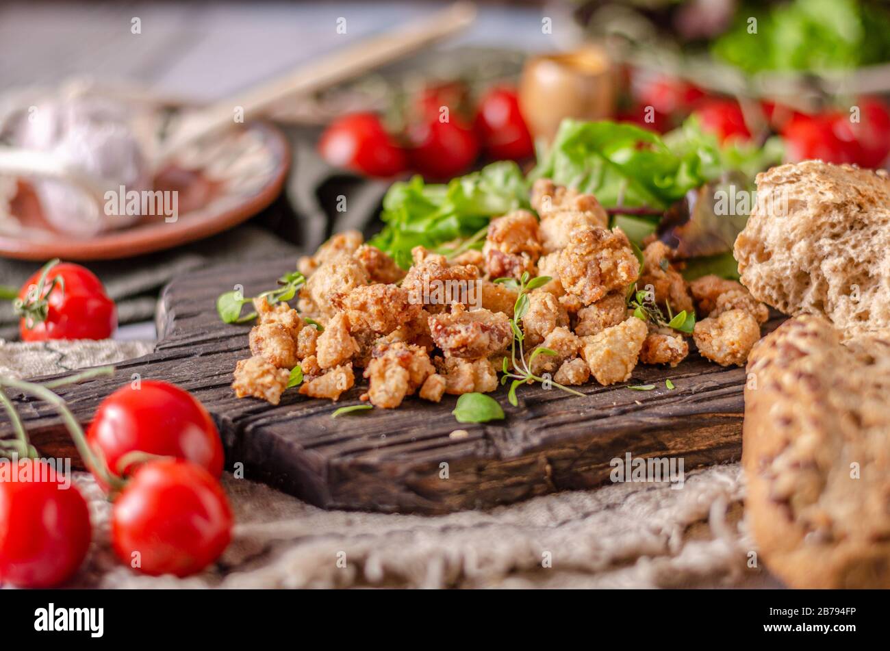 Delicious fat food, fried greaves pork with garlic Stock Photo - Alamy