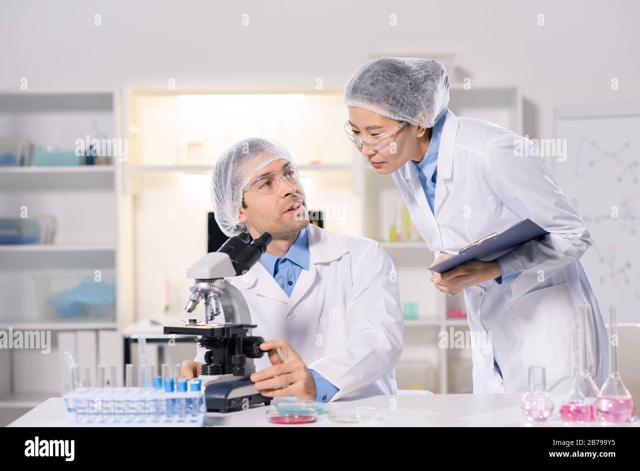 Smiling young scientists in hi-res stock photography and images - Alamy